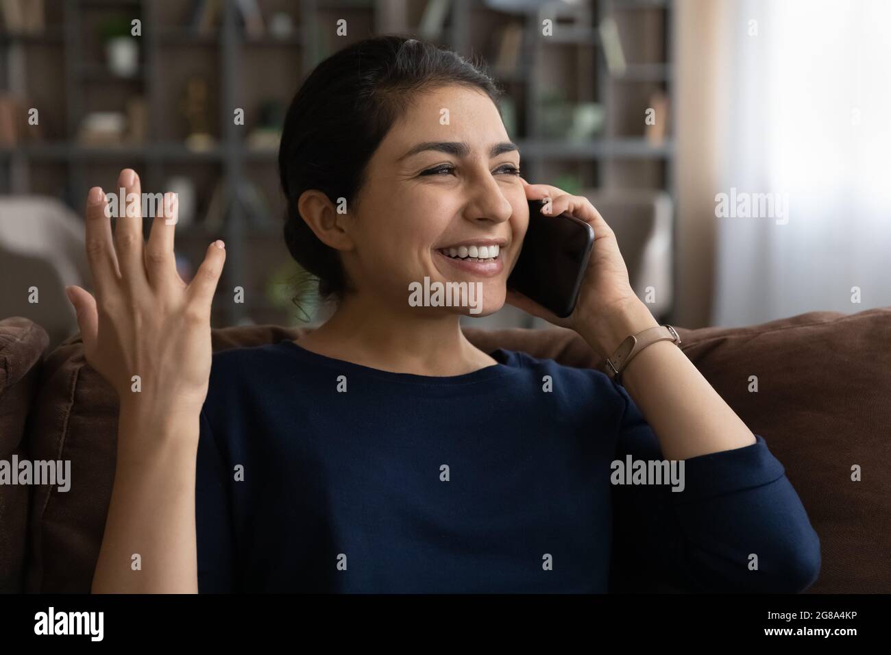 Smiling Indian woman have pleasant cellphone call Stock Photo - Alamy