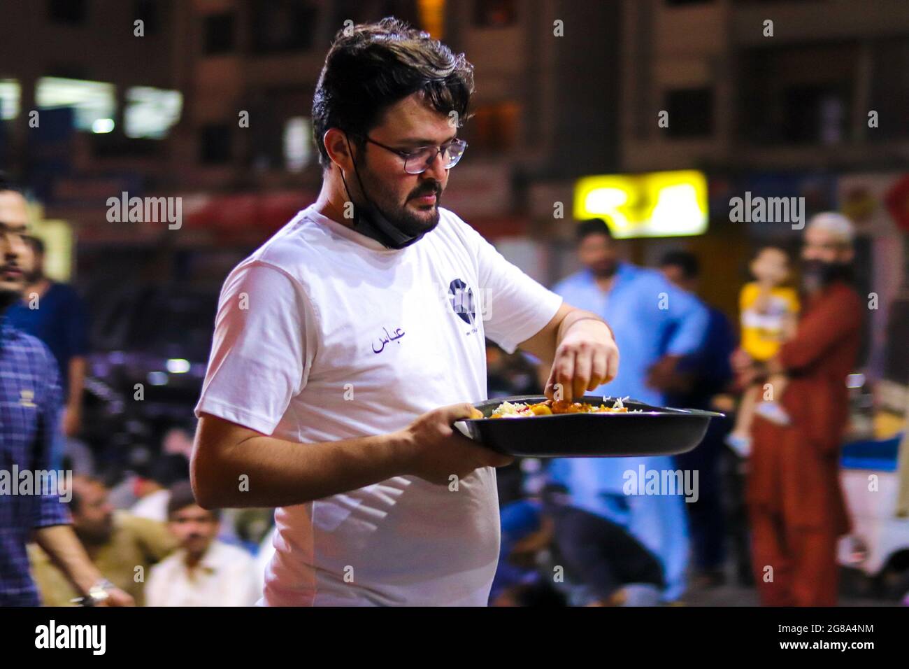 KARA, PAKISTAN - Jun 05, 2021: A closeup of a man eating biryani, a ...