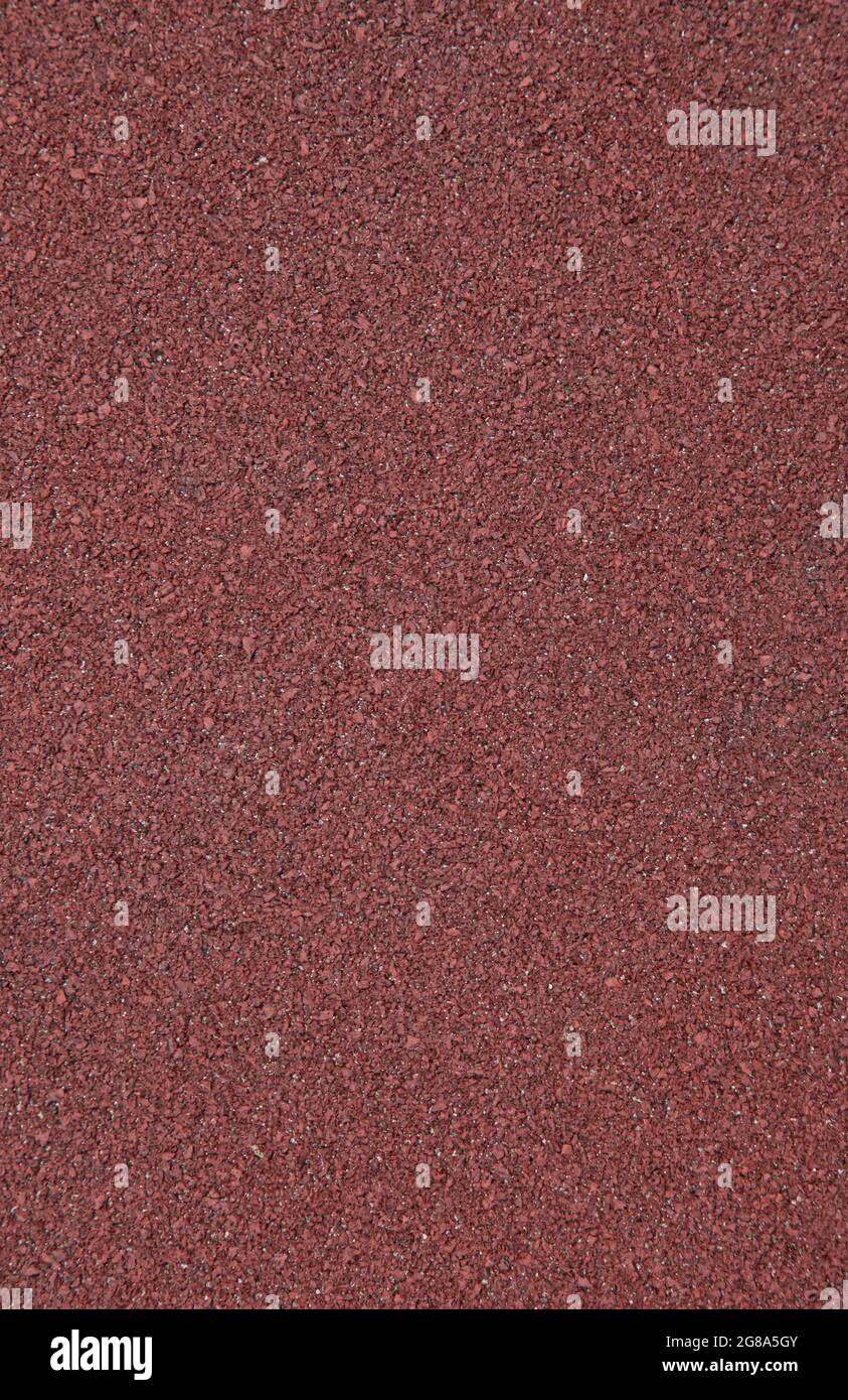 Red rubber floor, texture, background. Relief surface. Faded, old ...