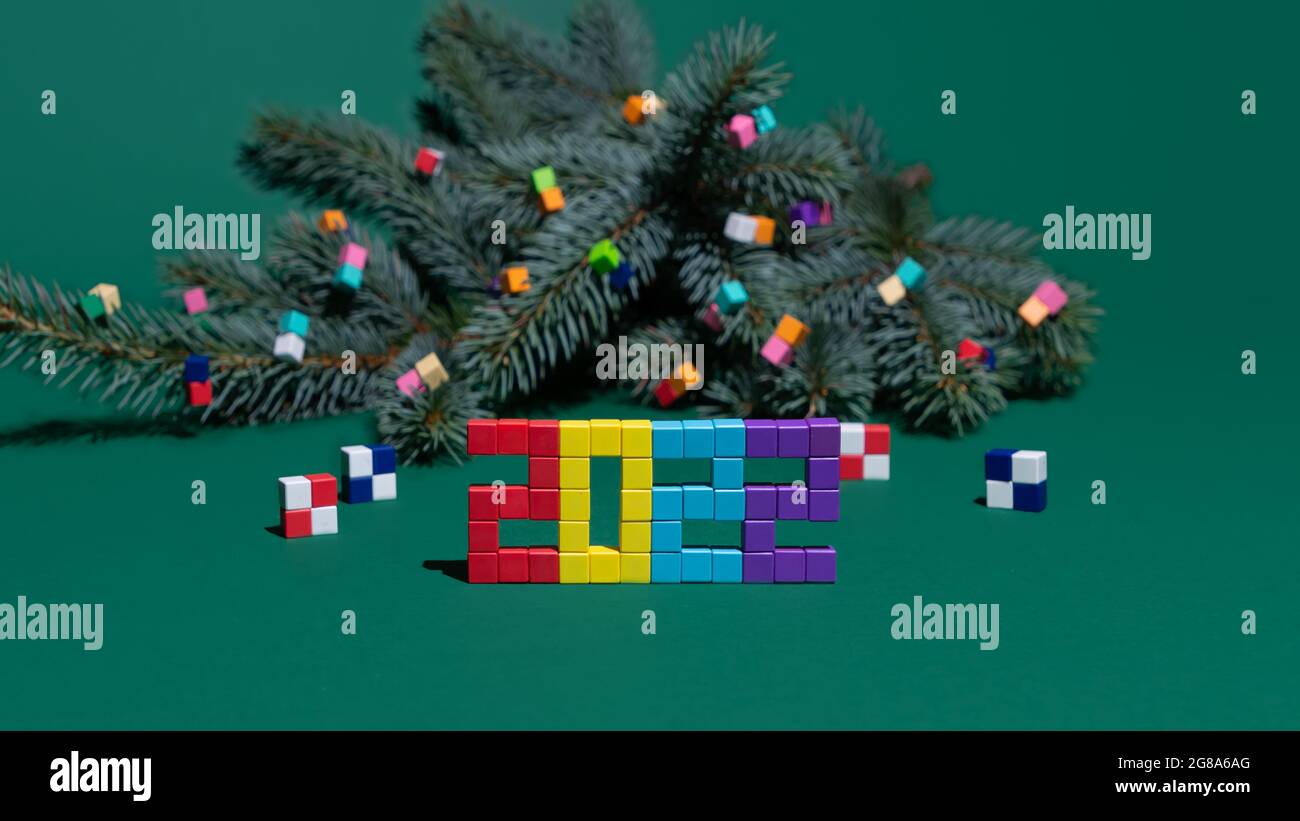 Christmas composition with a fir tree branch and colorful cubes from a ...