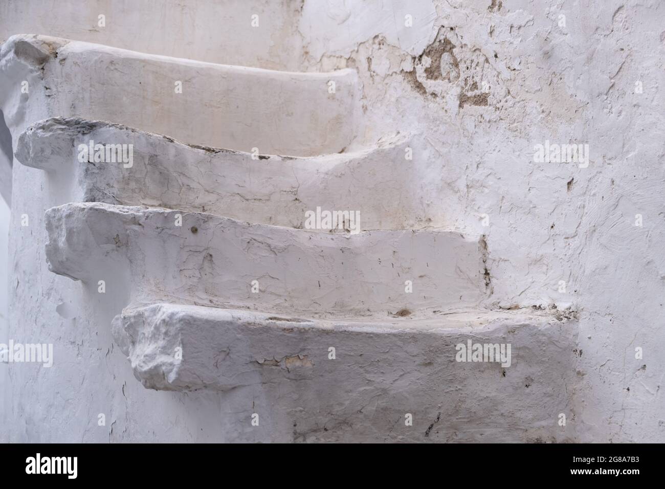 Stairs on exterior white building wall, Greek island Cyclades ...