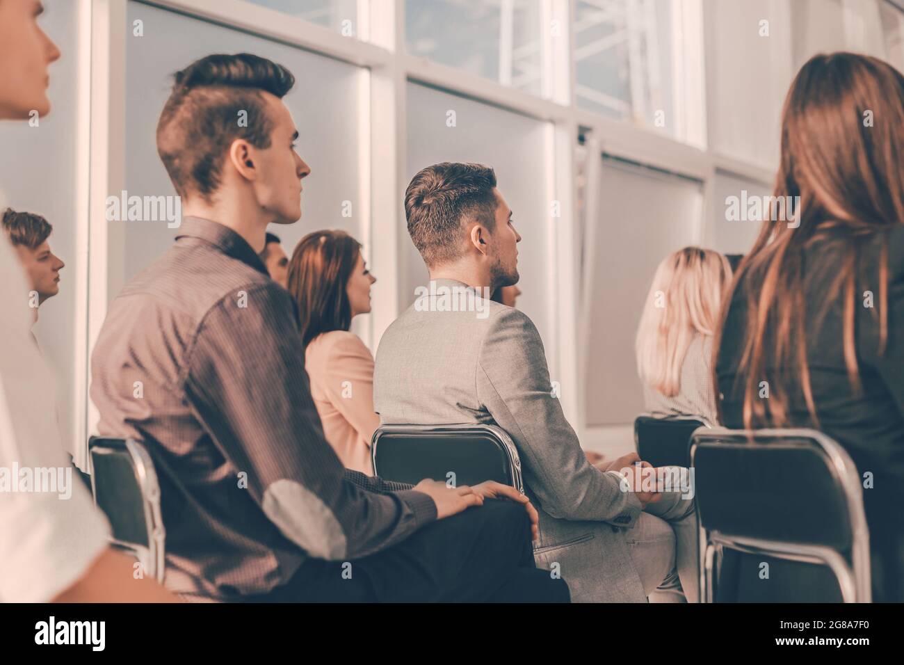 Classroom sitting listening learning education crowded hi-res stock ...