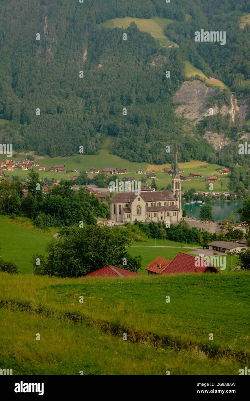 Swiss village Lungern with its traditional houses and old church tower ...