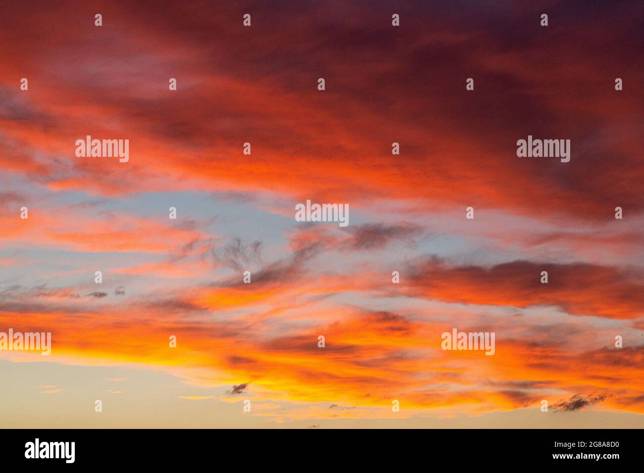 The sunset makes the sky shine in orange, yellow, red, blue, black ...