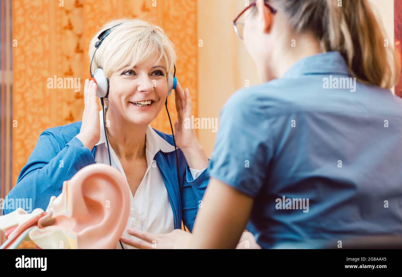 Deaf woman takes a hearing test Stock Photo - Alamy