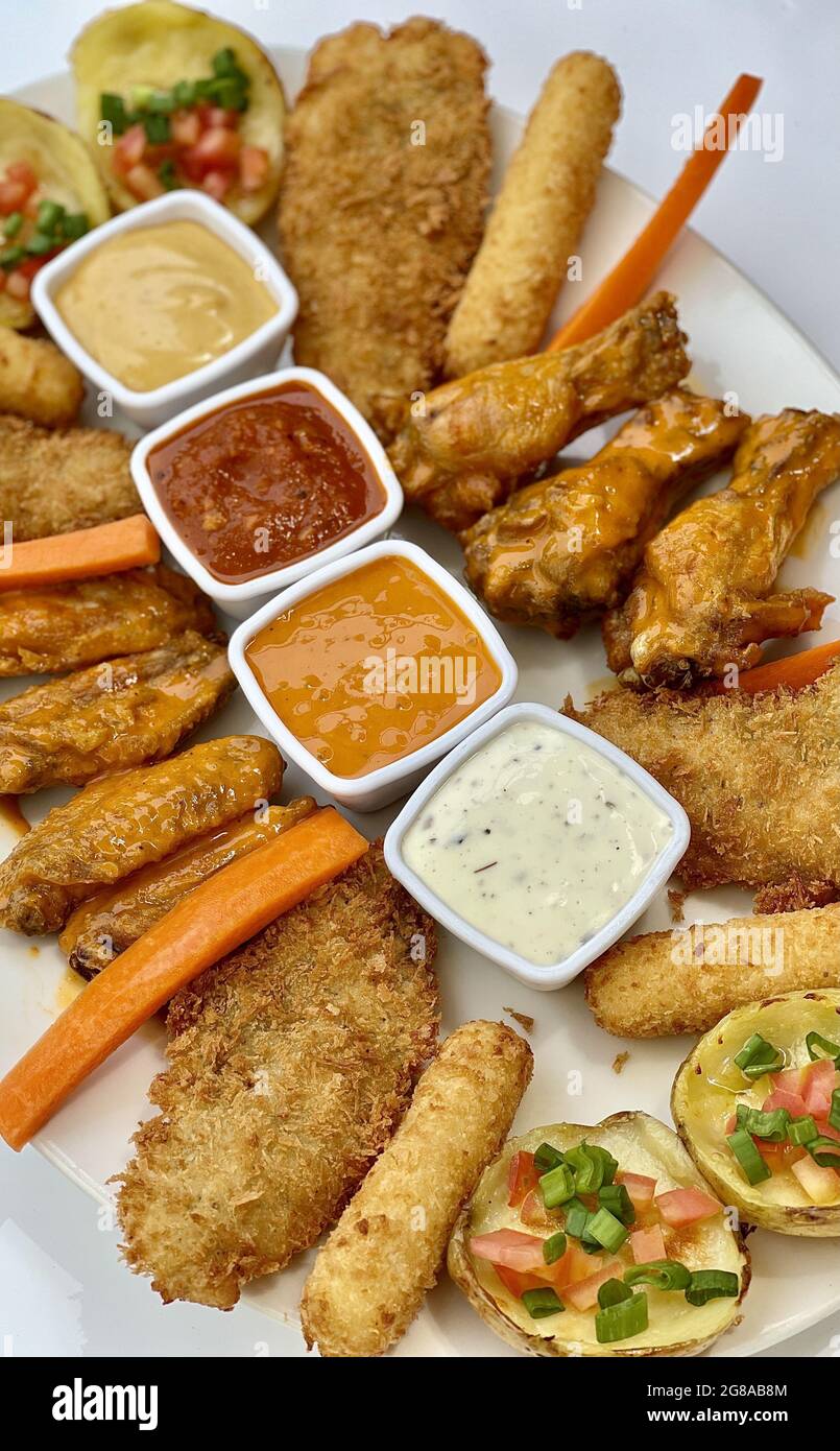 A vertical shot of a dinner table with various types of food Stock ...