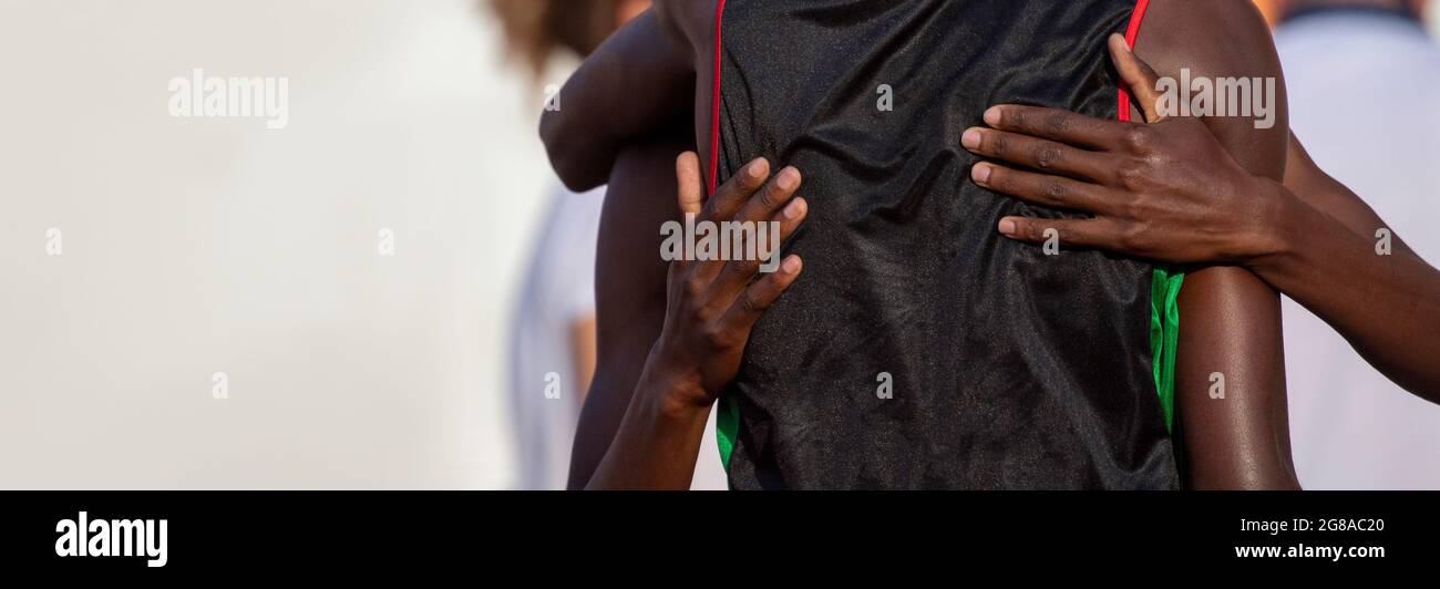 Athletes embrac after the competition. Professional sport concept ...