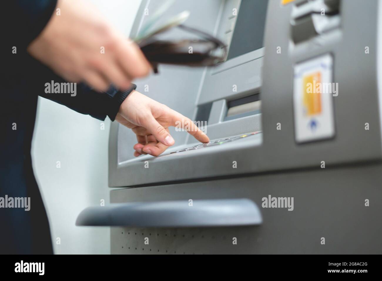 Inserting credit card in atm hi-res stock photography and images - Alamy