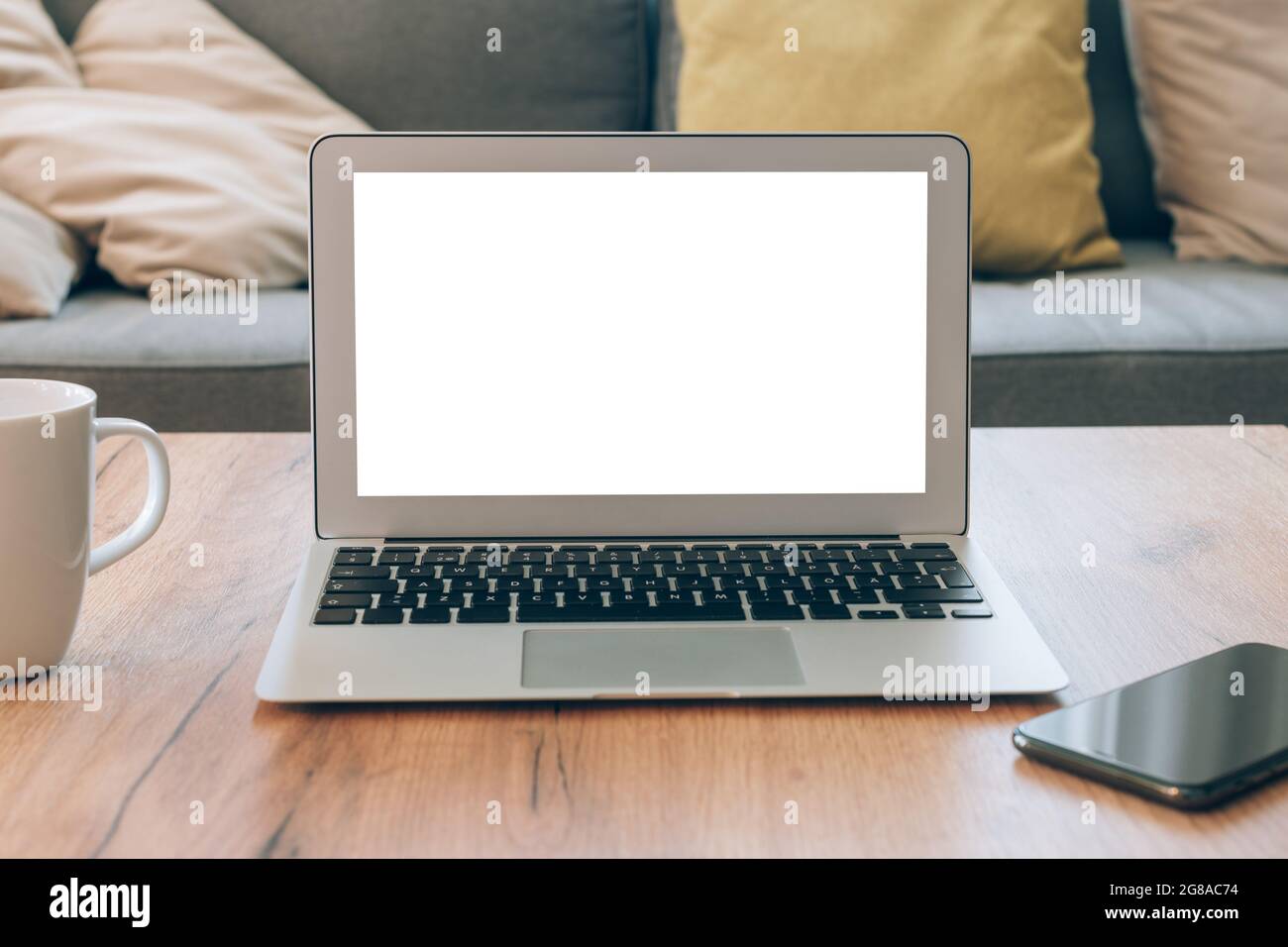 Laptop computer blank empty mock up screen in home office interior ...