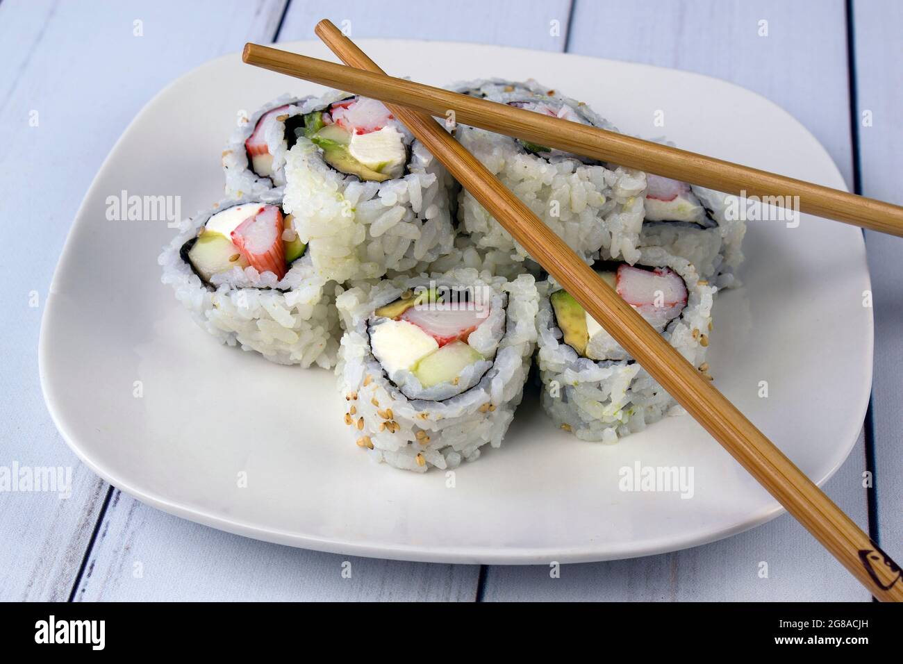 california cheese roll arranged on a plate with chop sticks Stock Photo ...