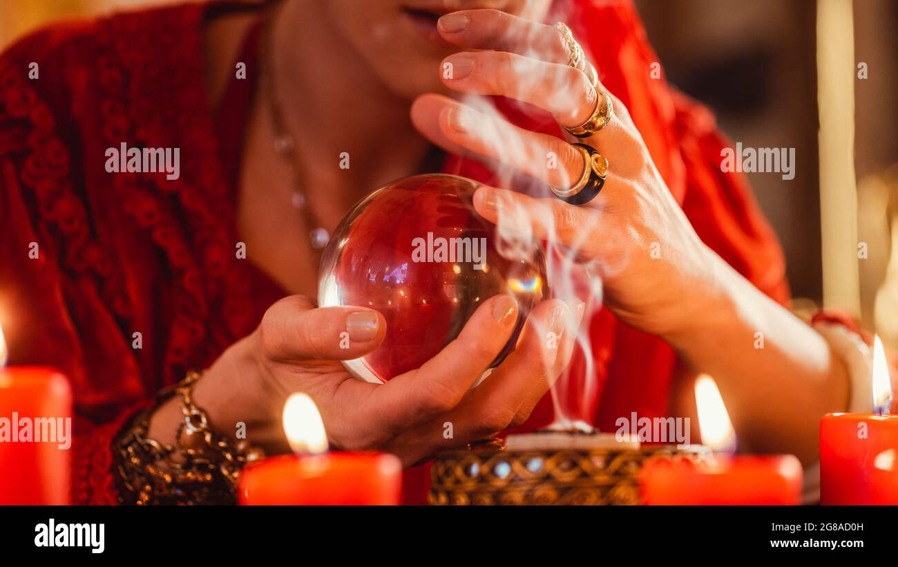Soothsayer during a Seance or session with Crystal ball Stock Photo - Alamy