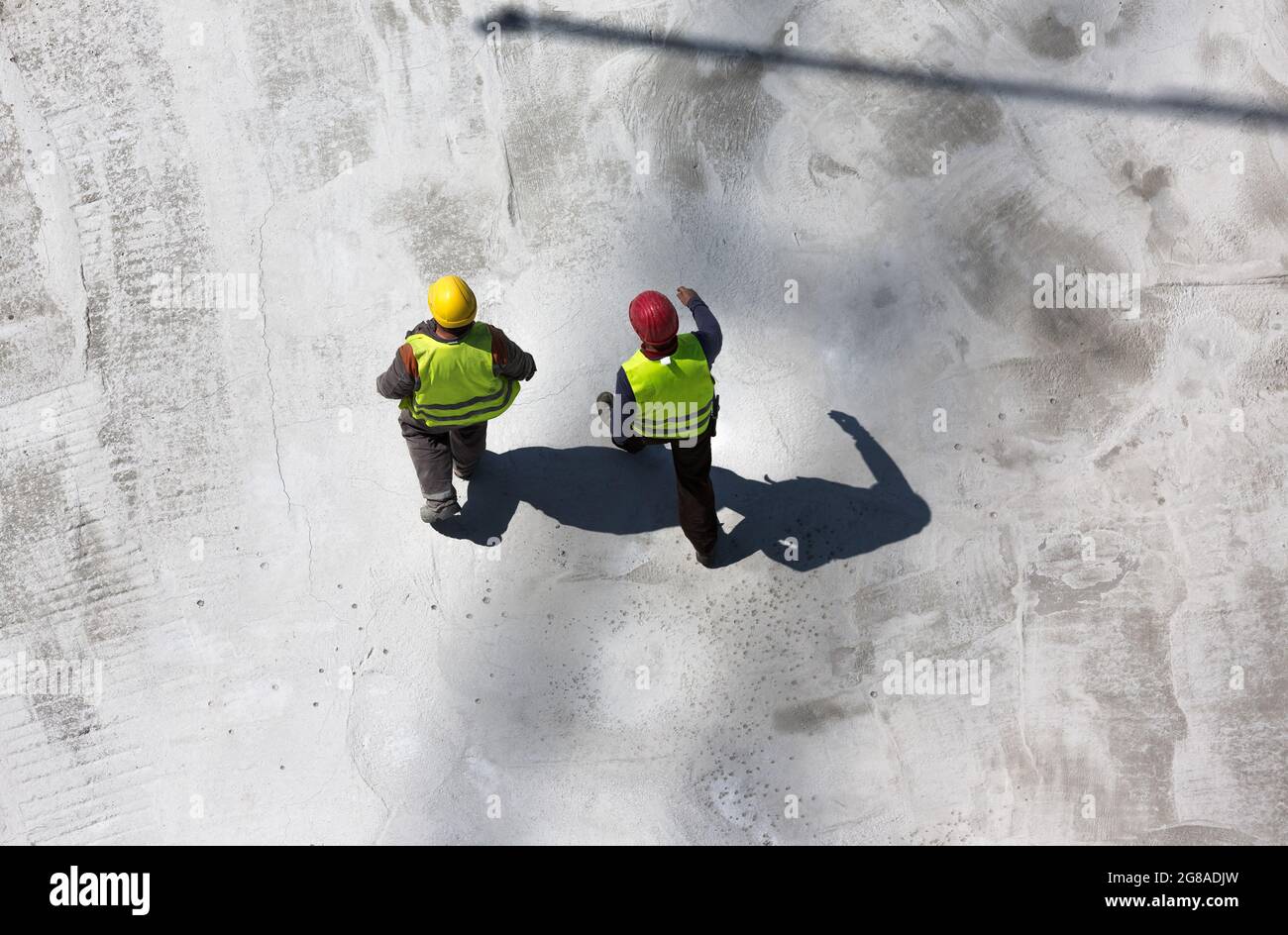 aerial view of two workers walking across the construction site Stock ...