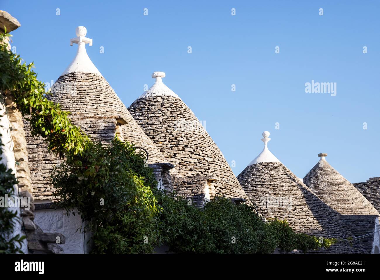 Beautiful town of Alberobello with typical trulli houses built from ...