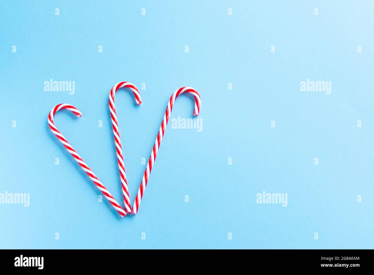 Christmas candy canes and fir branches flat lay Stock Photo - Alamy