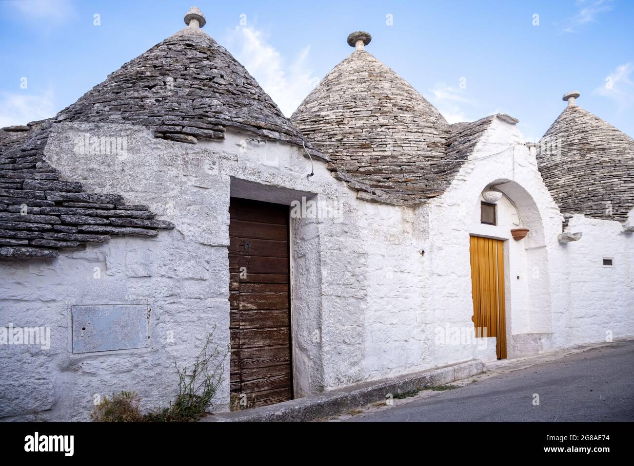 Beautiful town of Alberobello with typical trulli houses built from ...