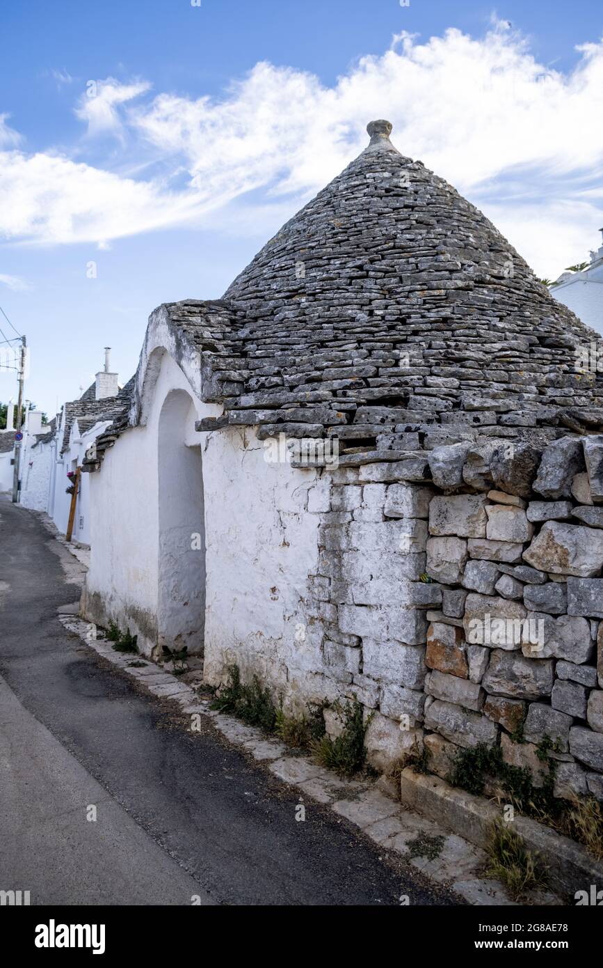 Beautiful town of Alberobello with typical trulli houses built from ...