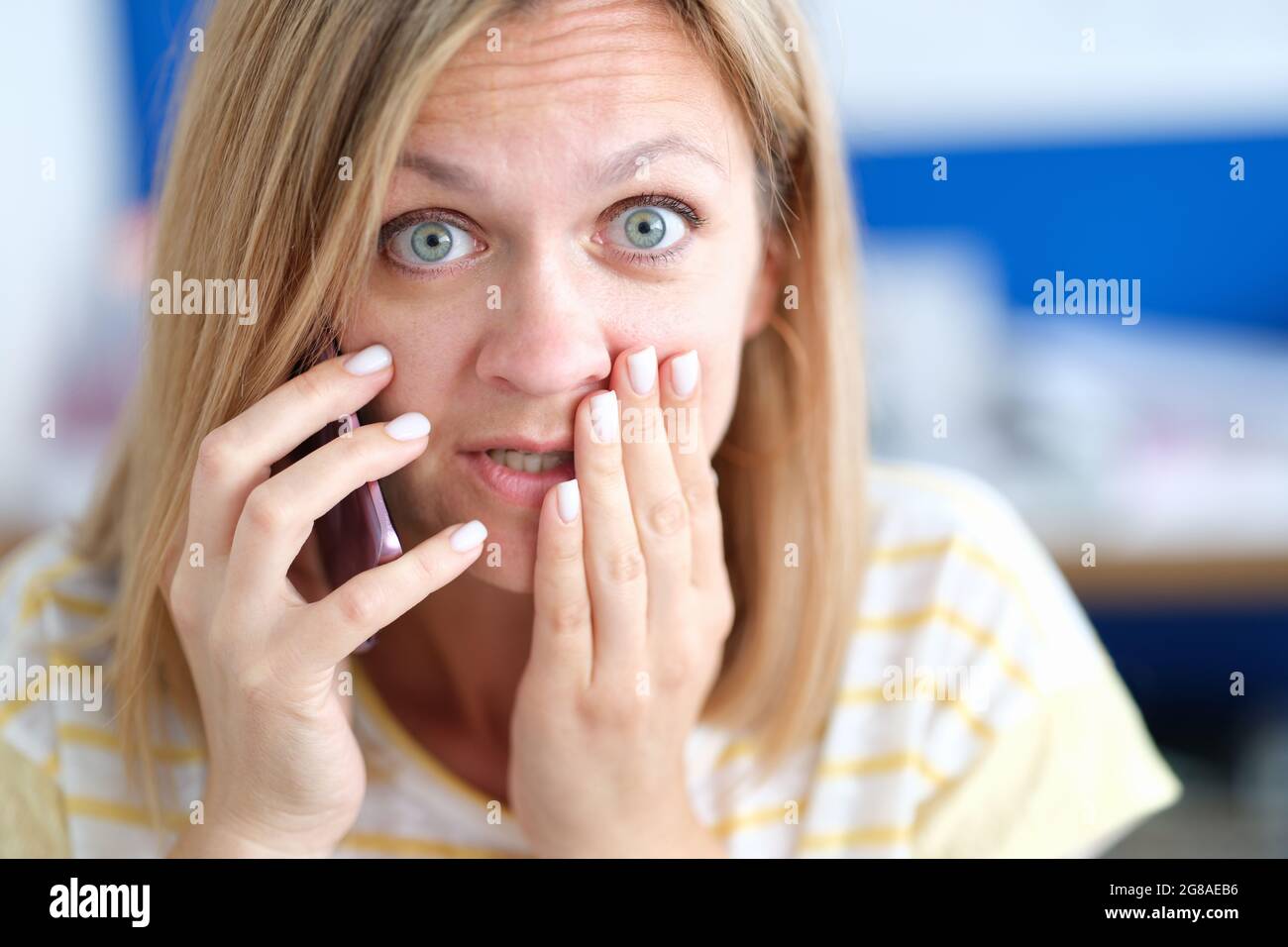 Emotionally confused woman talking on phone closeup Stock Photo - Alamy