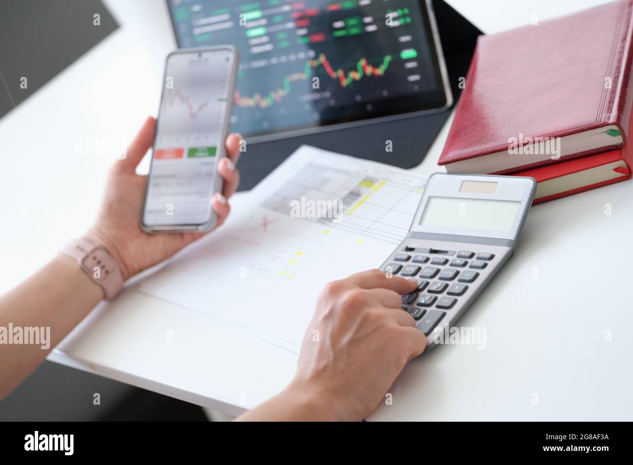Businesswoman studies financial charts hi-res stock photography and ...