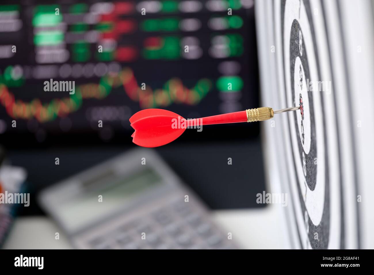 Darts with a dart in center in the background laptop screen with stock ...