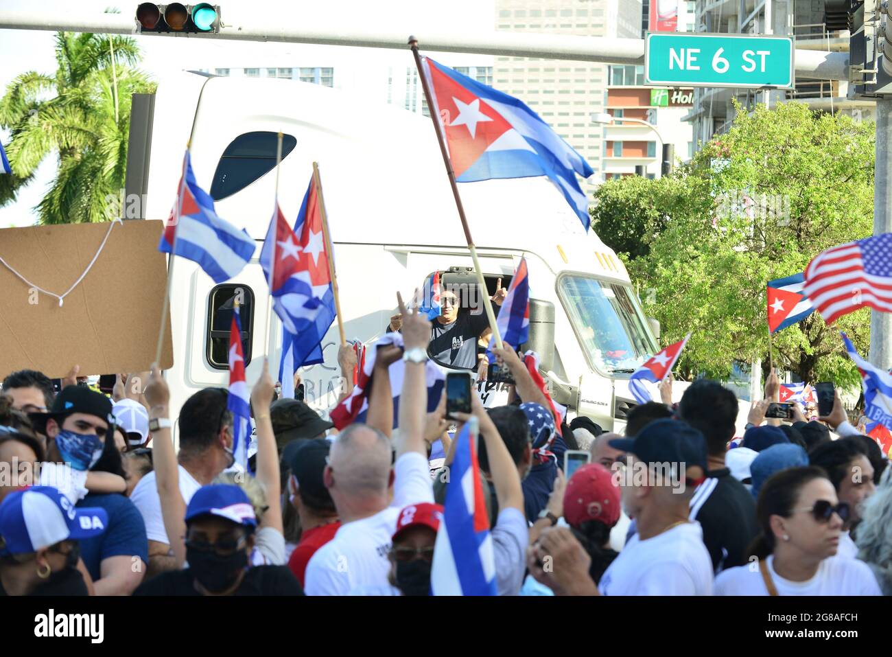 MIAMI, FLORIDA - JULY 17: People wave Cuban and US flags during a ...