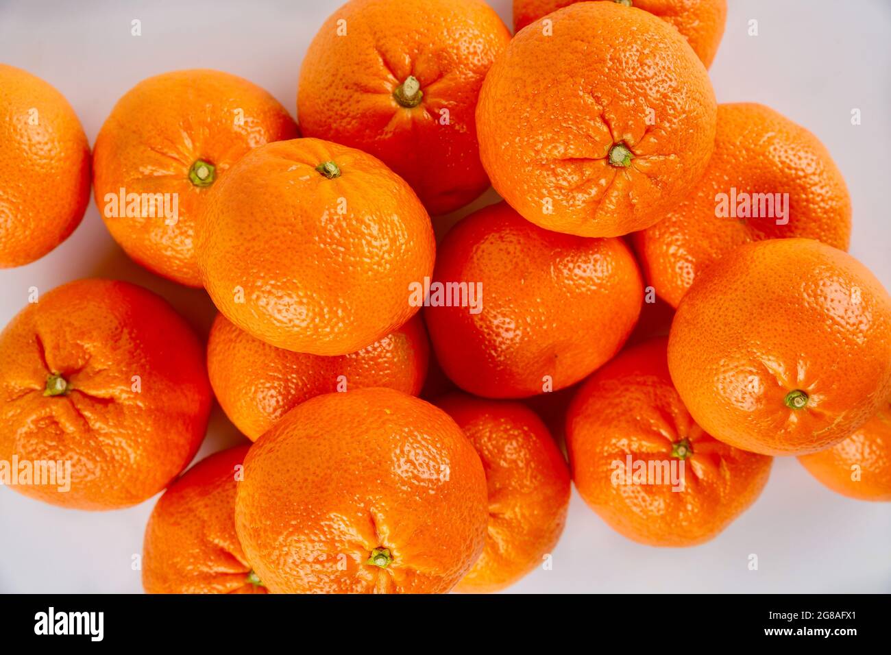 Fresh mandarin or tangerines on white background. Top view, close up ...