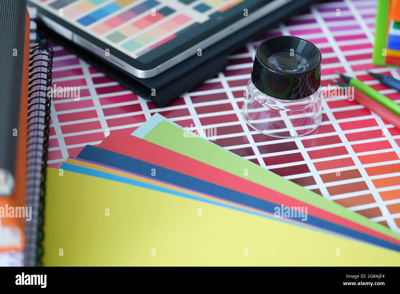 Color palette with colored paper and tablet with color samples lie on ...