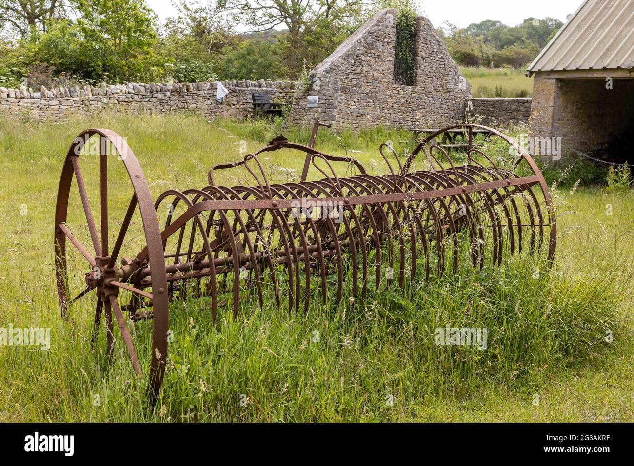 Rusty dump rake, Tyneham Village Farm, Dorset, UK; Evacuated in Dec ...
