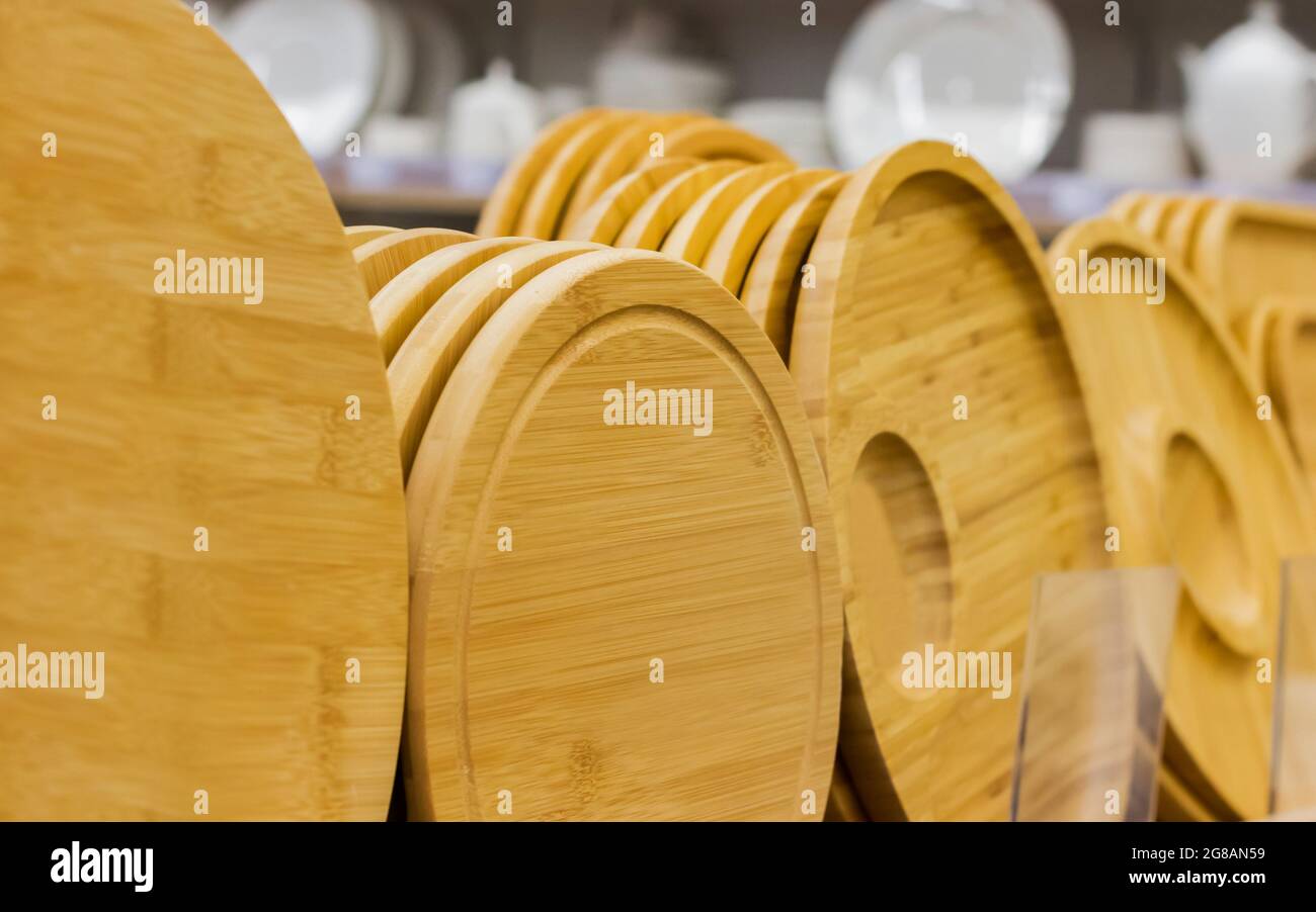 Photo of wooden kitchen boards row stand in store Stock Photo - Alamy