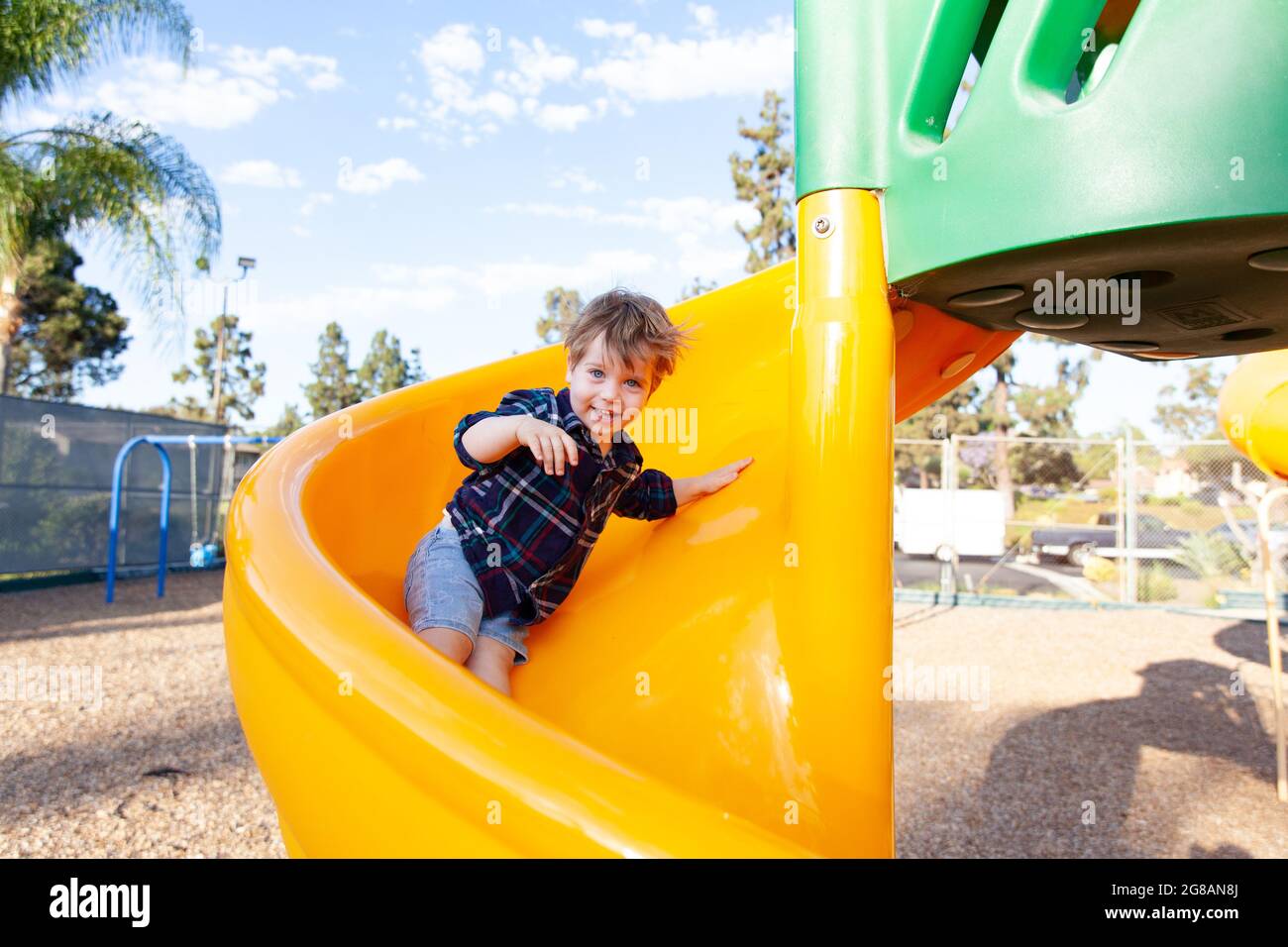 Modern colorful kids playground - swings, slides, steps and ladders ...
