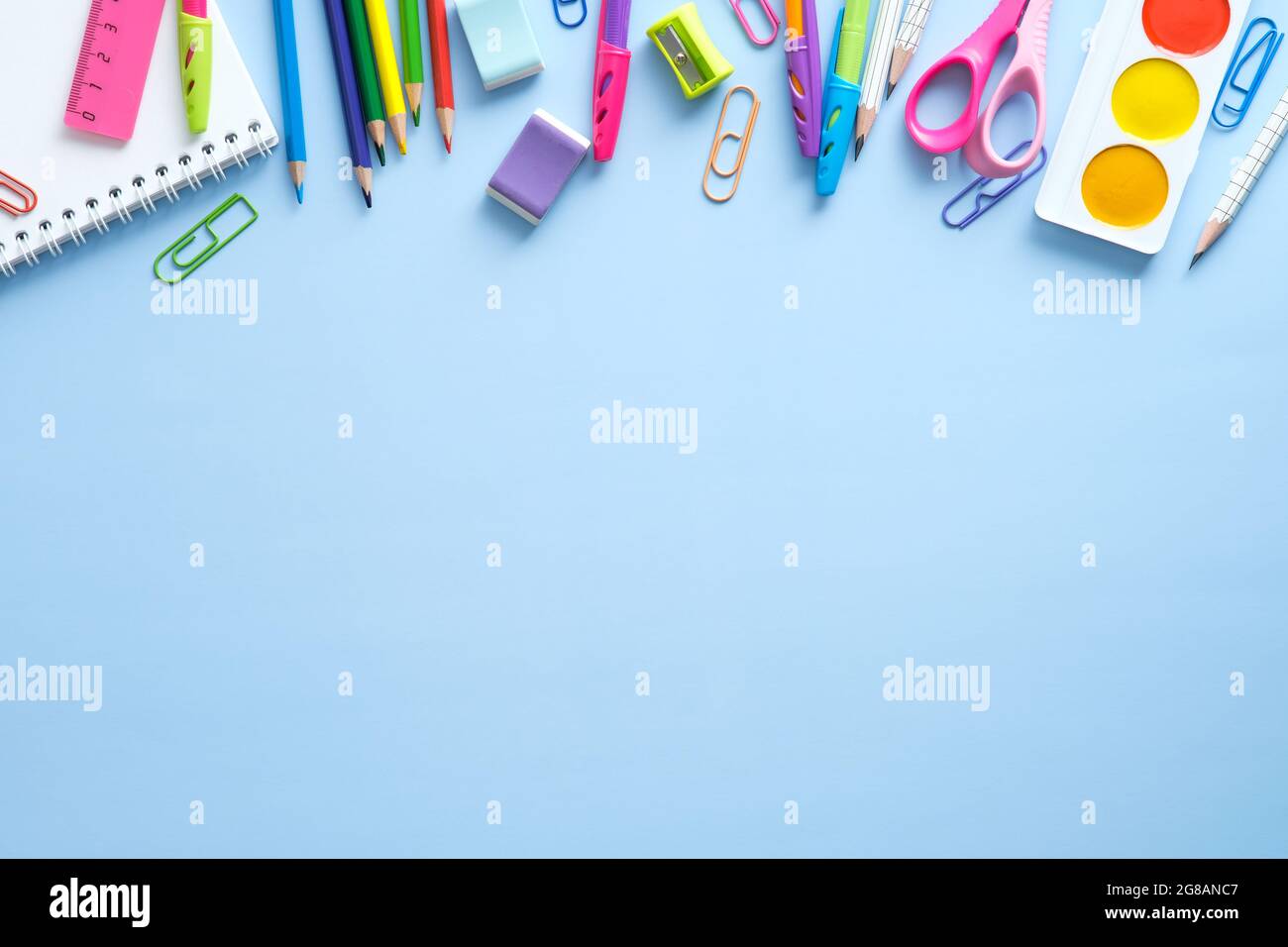 School stationery frame border top view. Back to school concept on blue ...