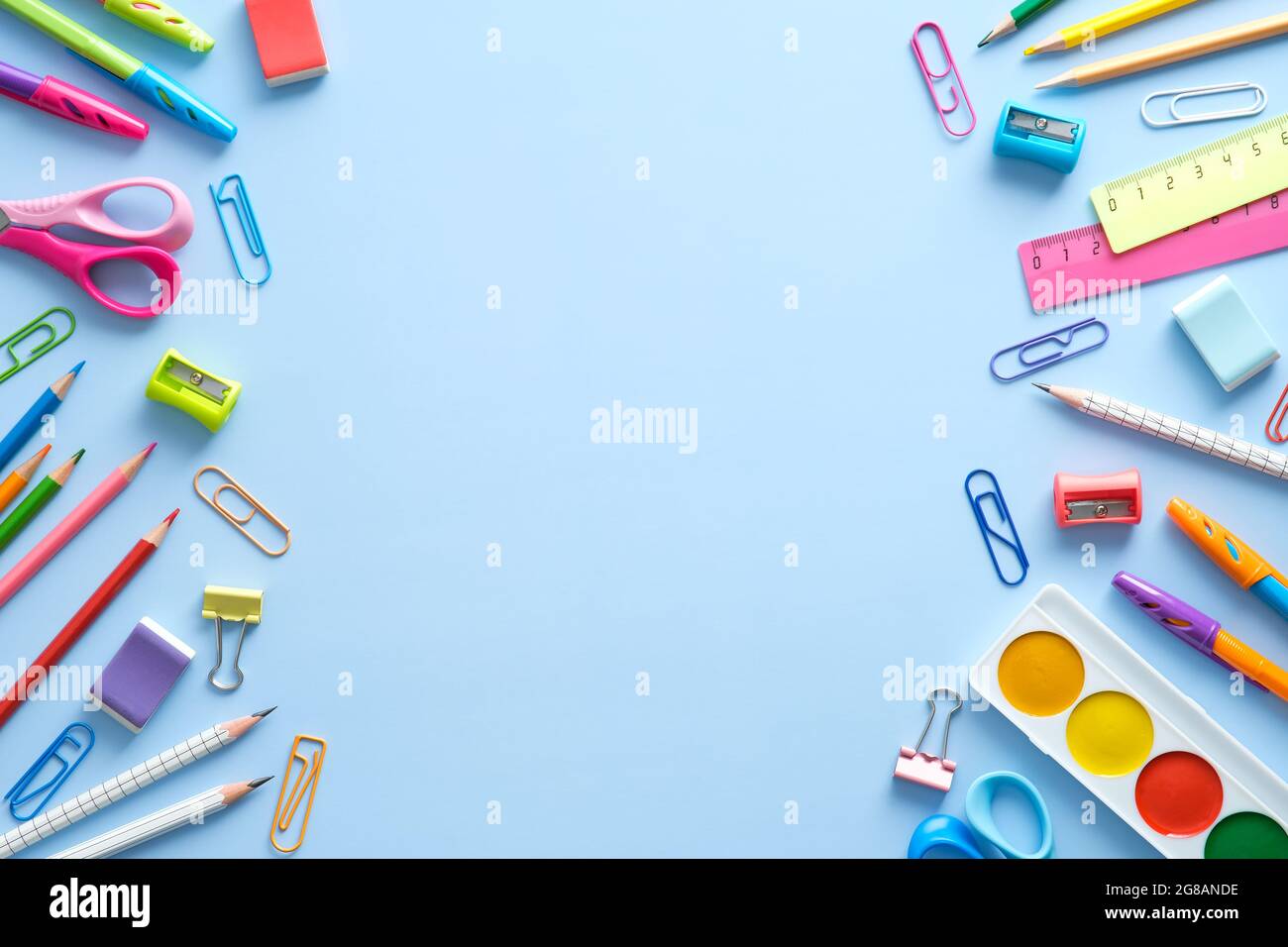 Flat lay colorful school supplies on blue background. Back to school ...