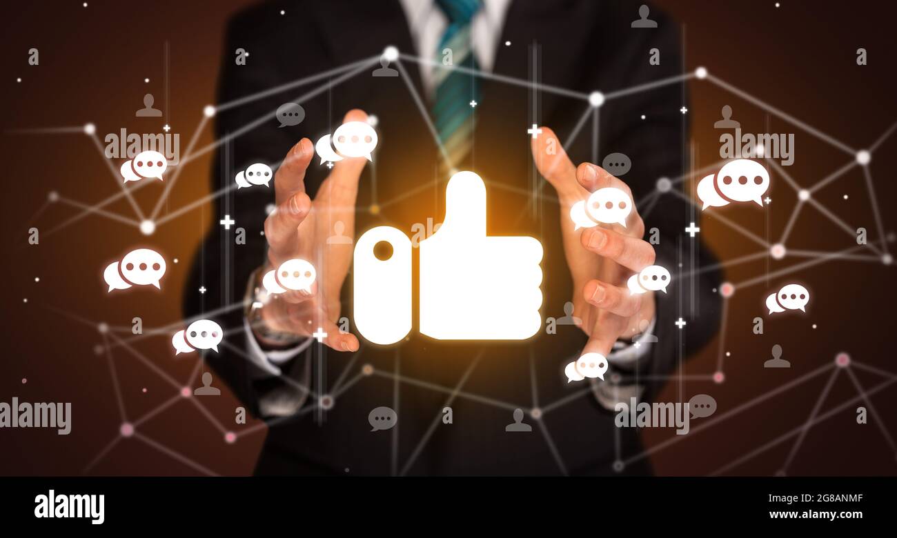 Hand holding social media icons Stock Photo - Alamy