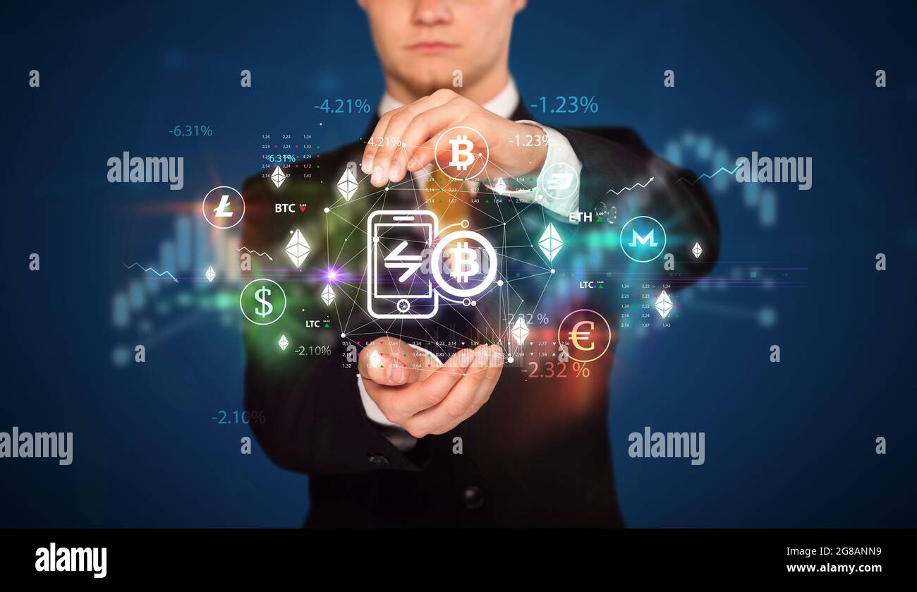 Businessman holding currency symbols concept Stock Photo - Alamy