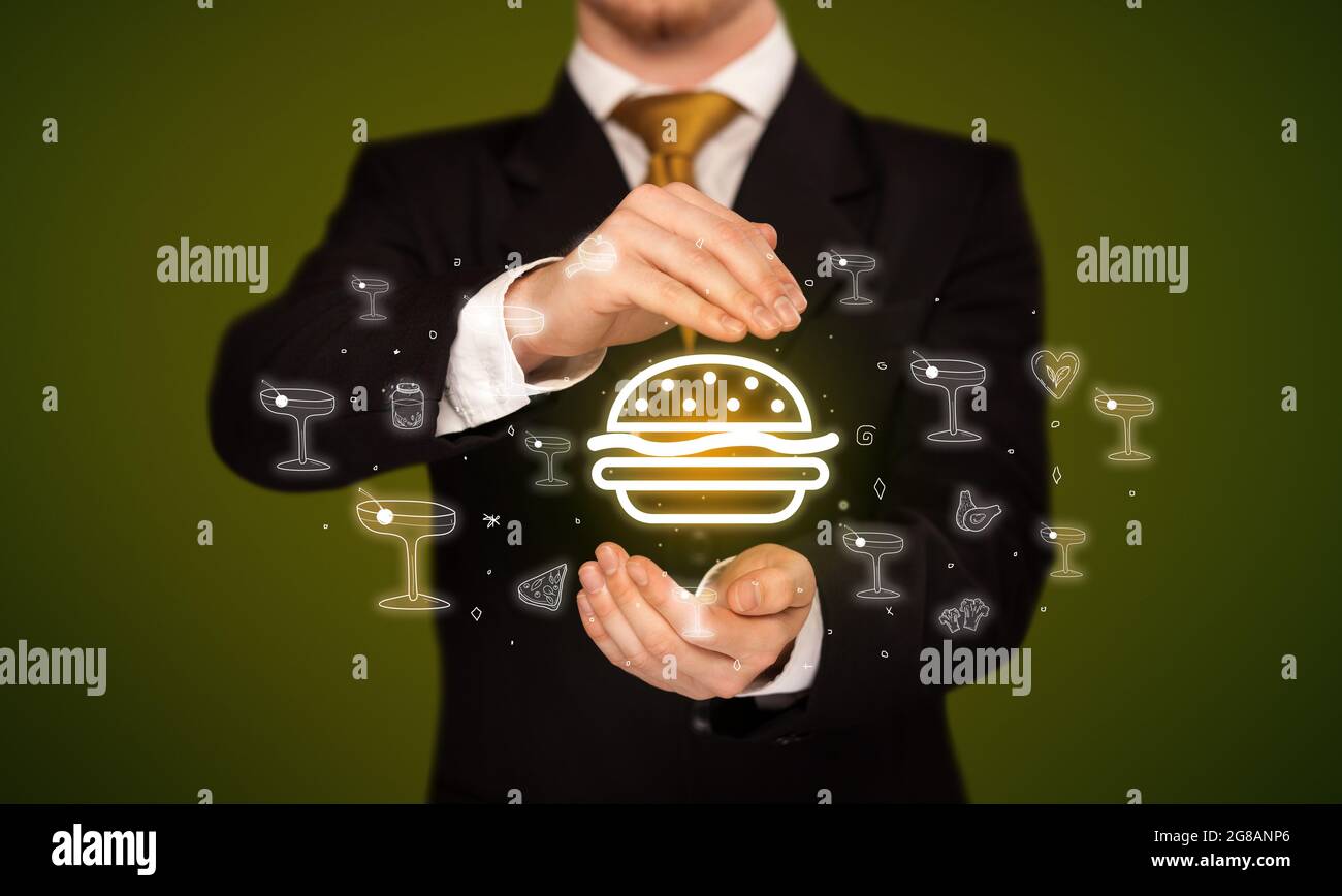 Hand holding food related icons Stock Photo - Alamy