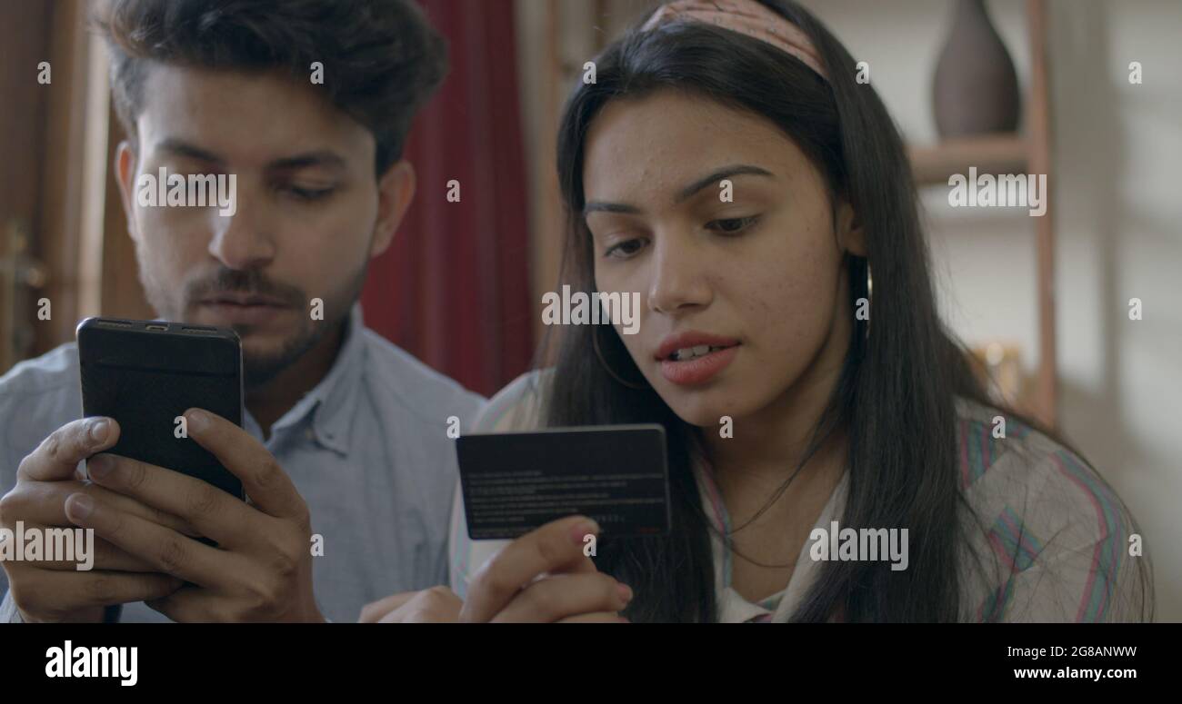 Young couple making payments hi-res stock photography and images - Alamy