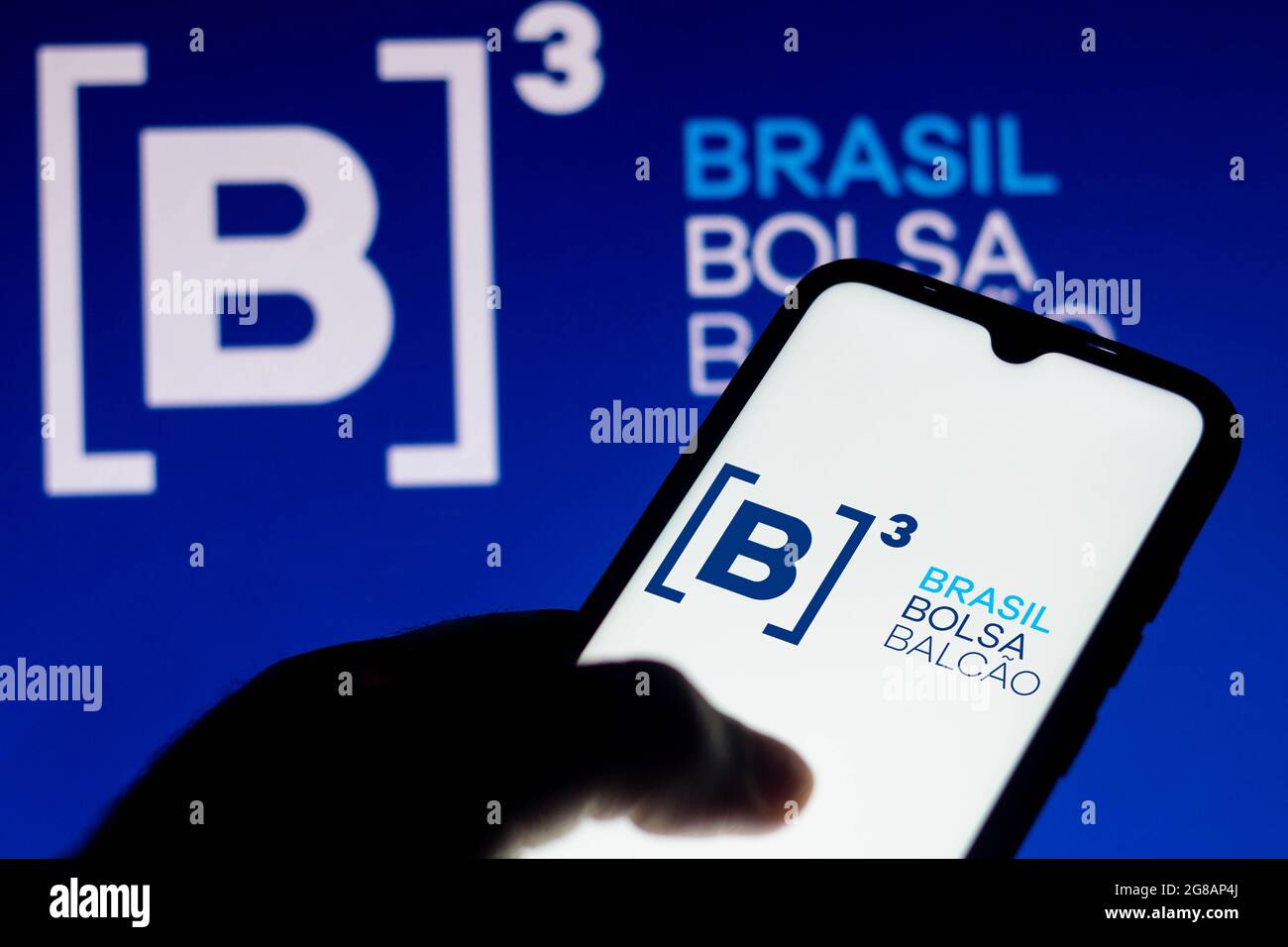 In this photo illustration the B3 logo is seen on a smartphone and a pc ...