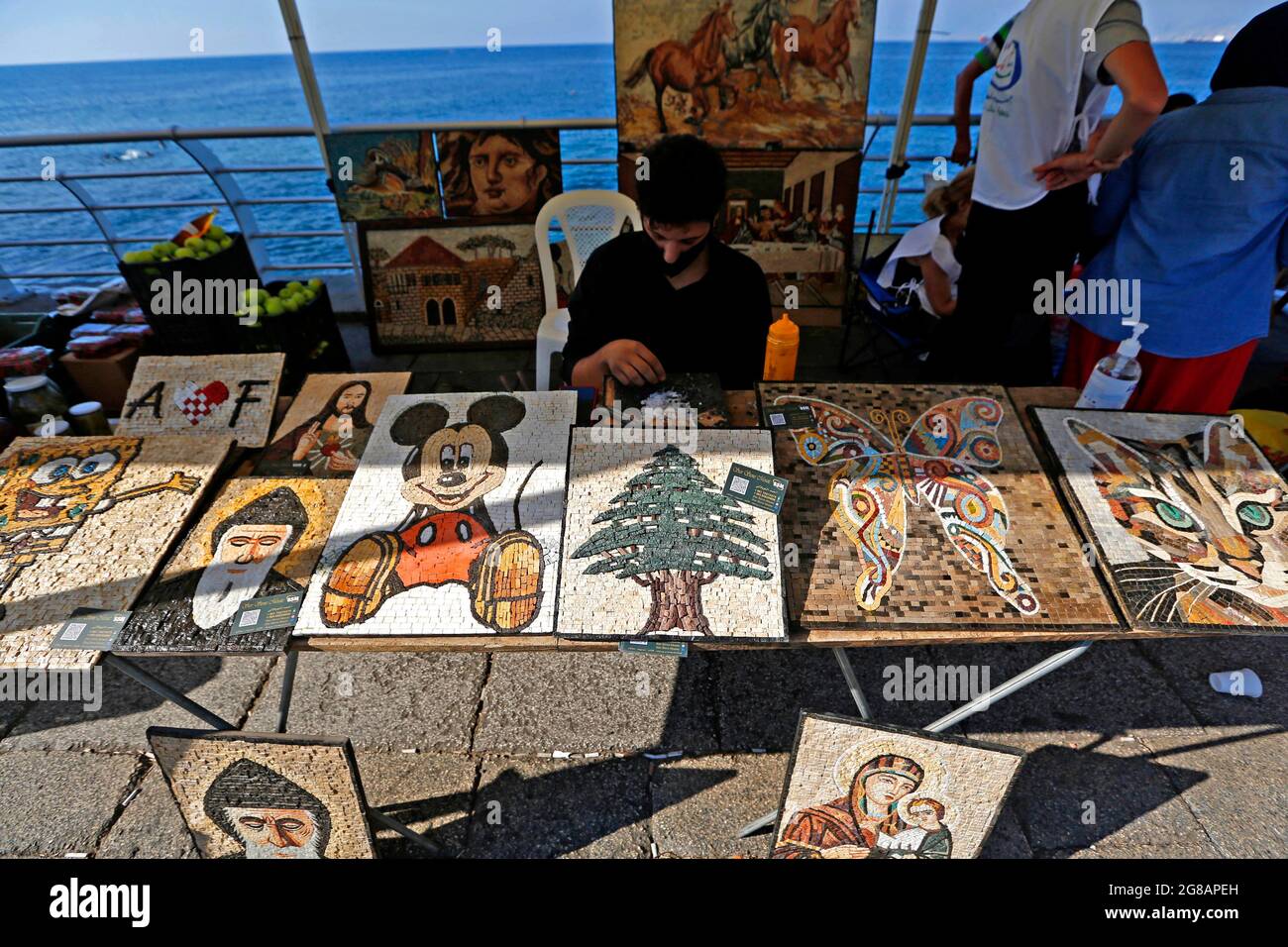 Beirut, Lebanon. 18th July, 2021. A man sells artworks at a popular ...