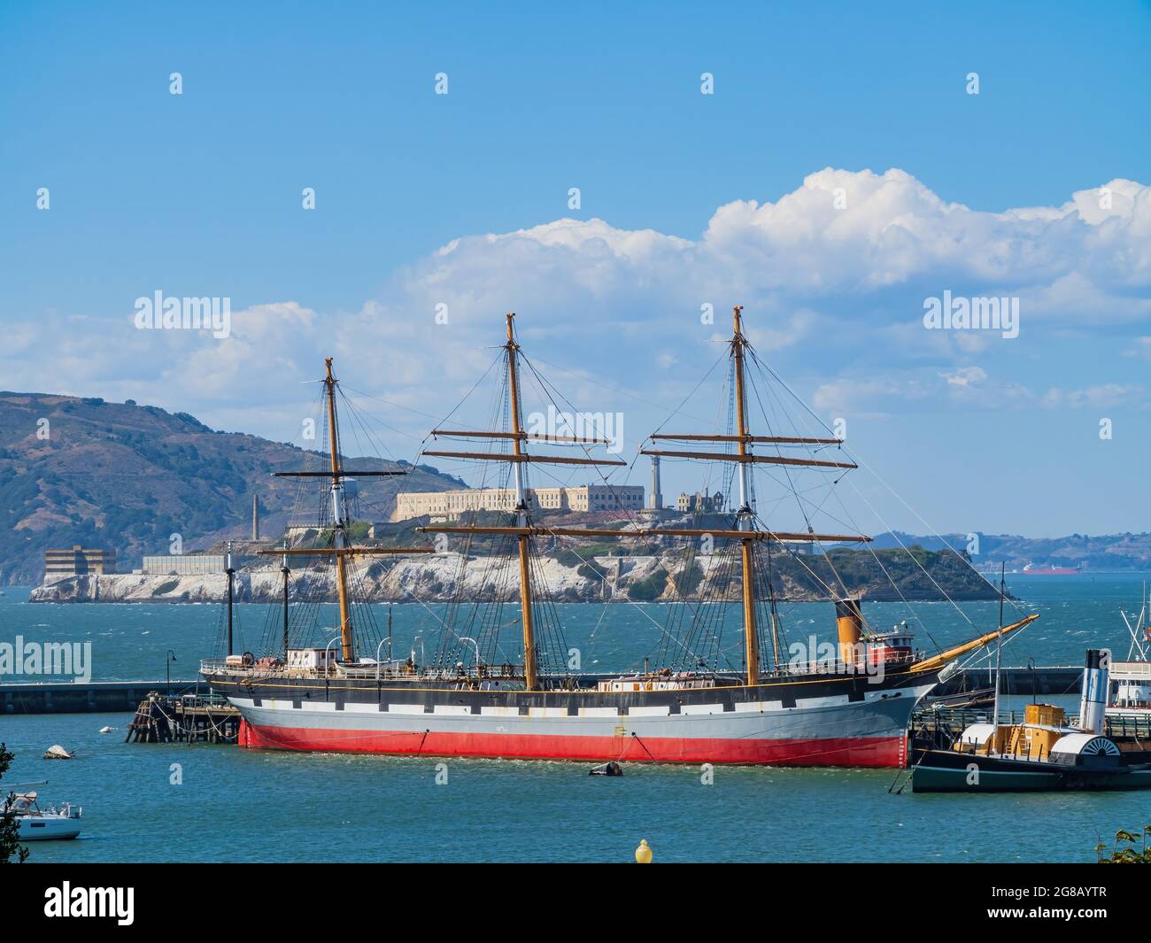 Sunny view of the Alcatraz Island and San Francisco Bay with a vessel ...