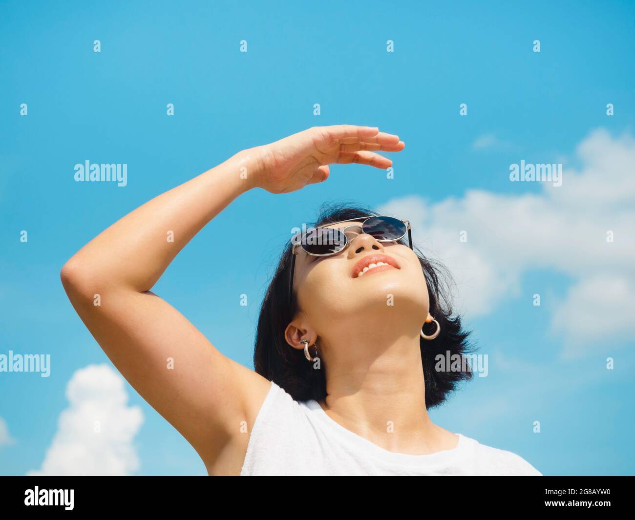 Woman shading eyes with her hand hi-res stock photography and images ...