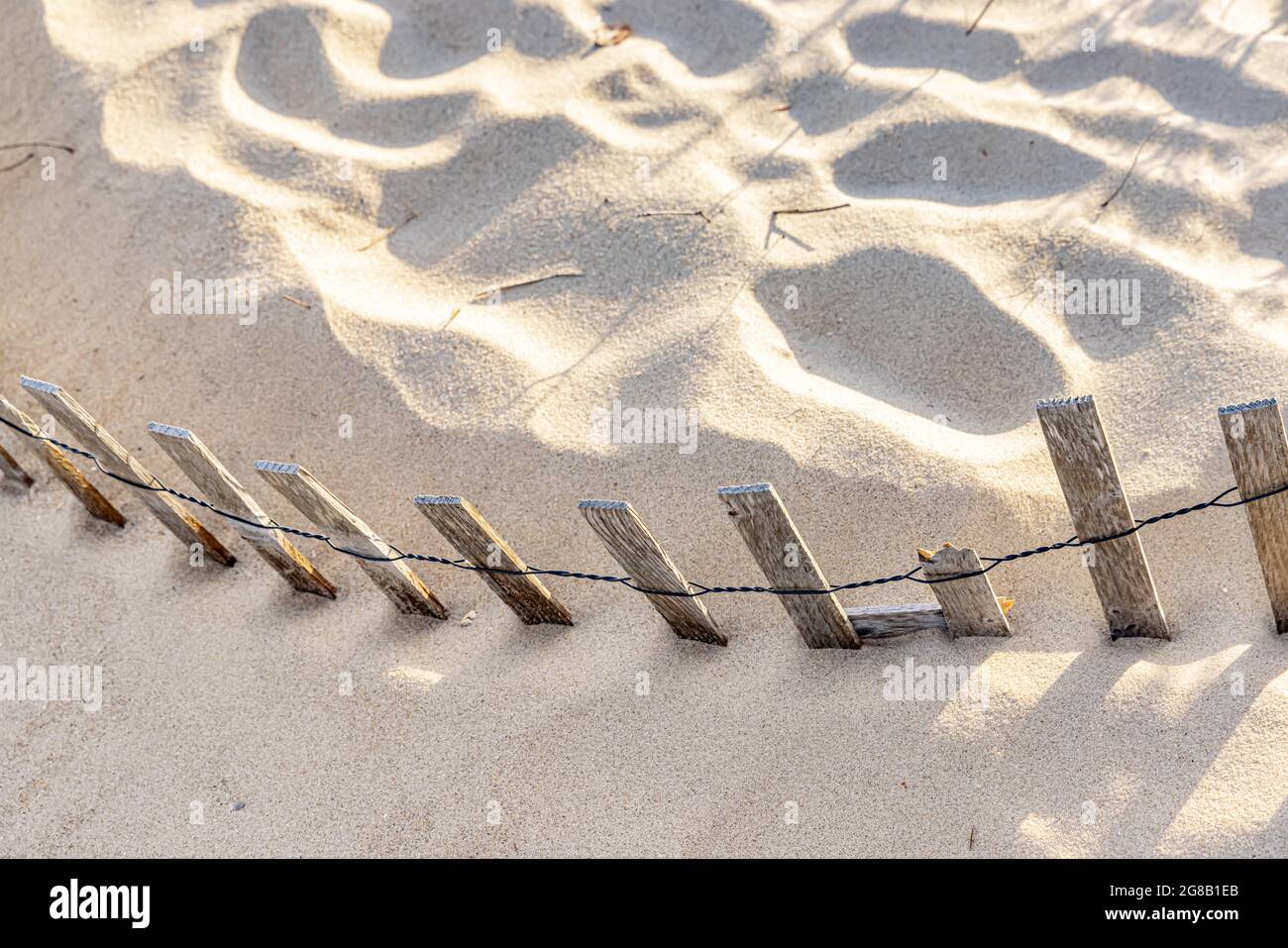 detail image of beach fencing in sand Stock Photo - Alamy