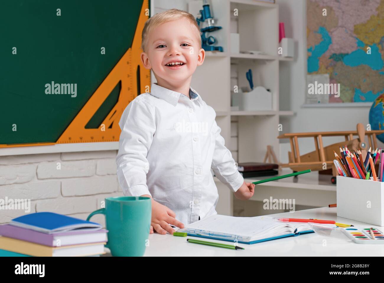 Individual teaching. Cute little preschool kid boy with teacher study ...