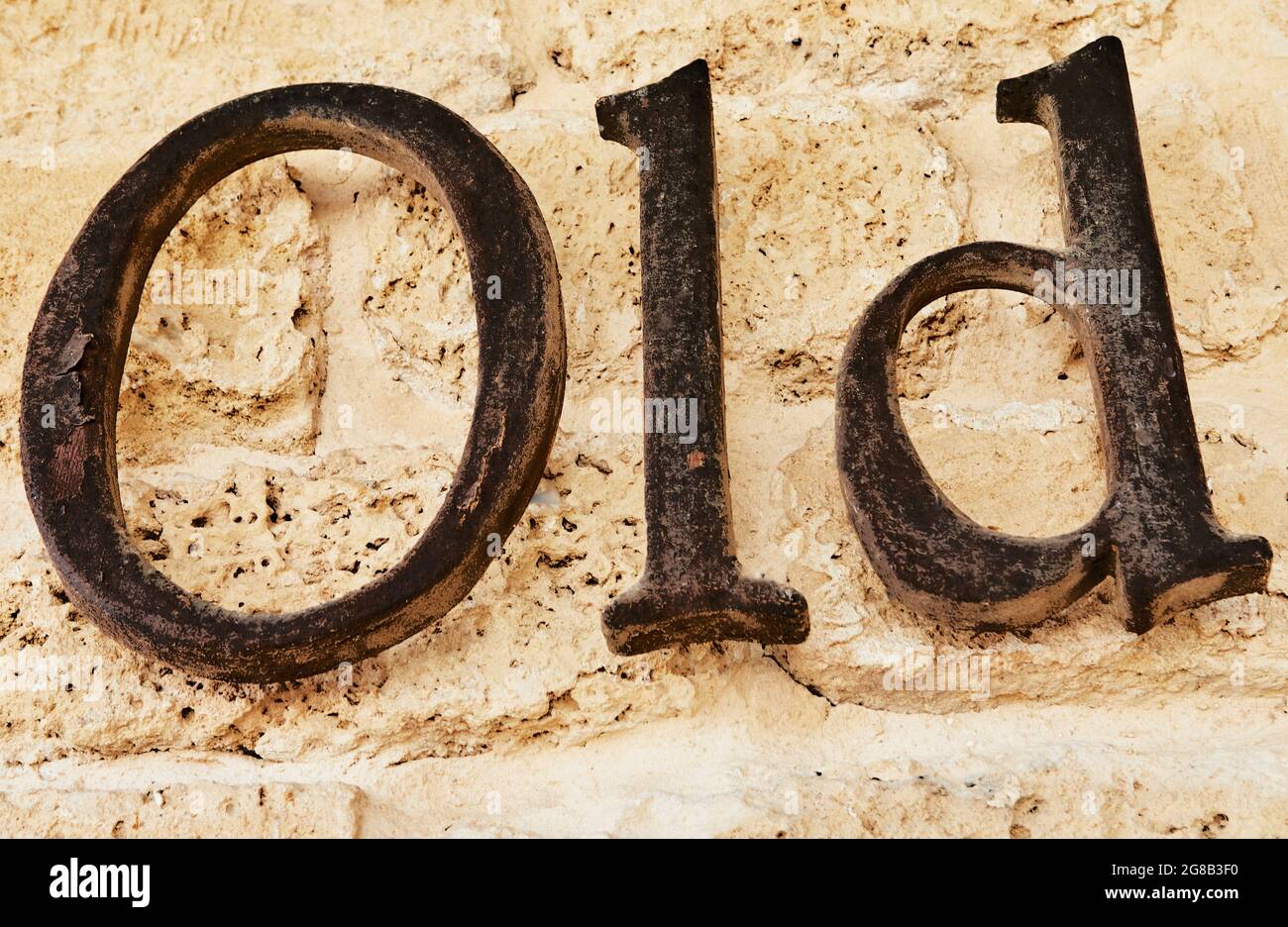 The word old in metal letters on stone background Stock Photo - Alamy