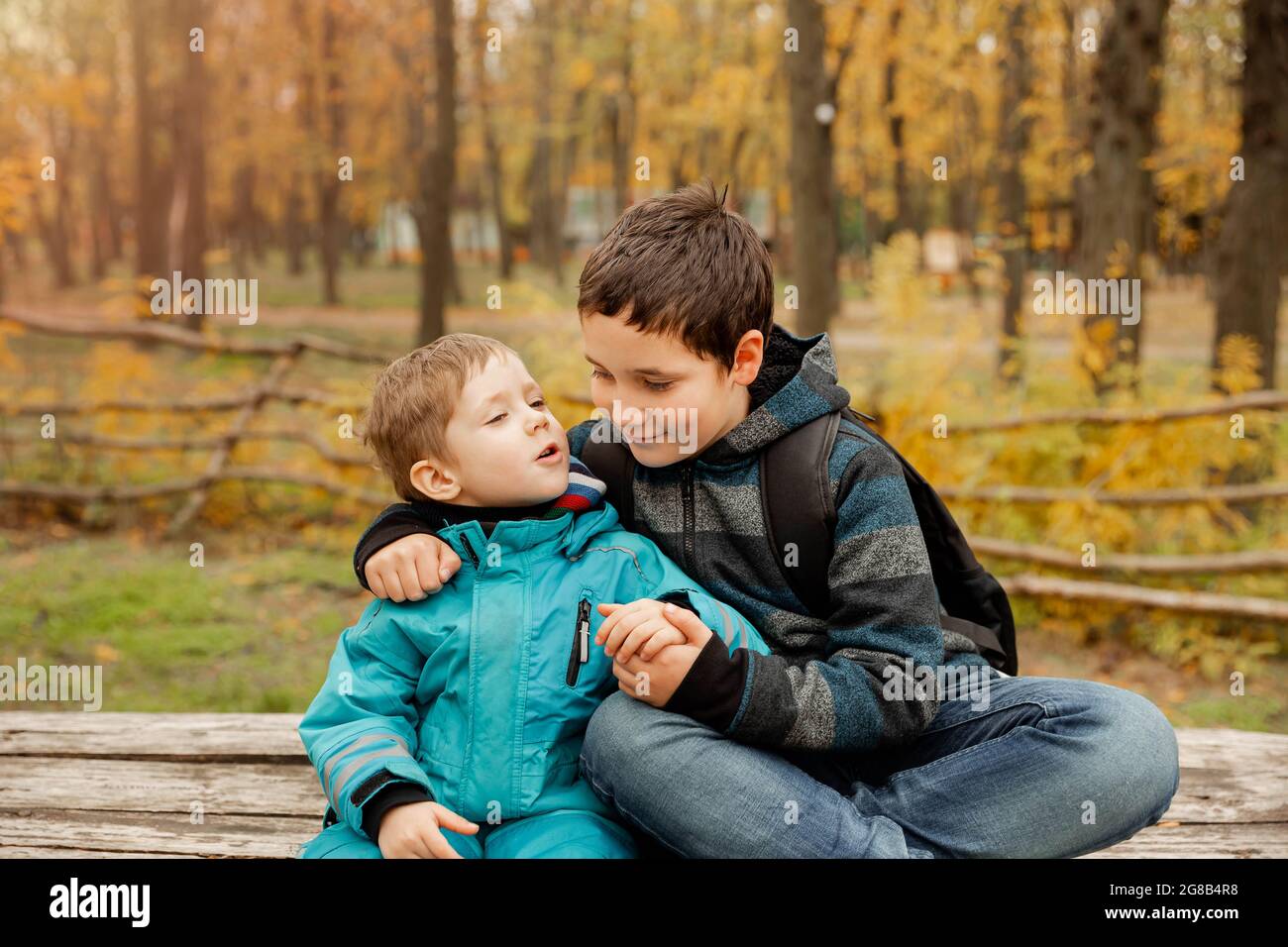 Two happy boys. Cute brothers who are smiling happily together Stock ...