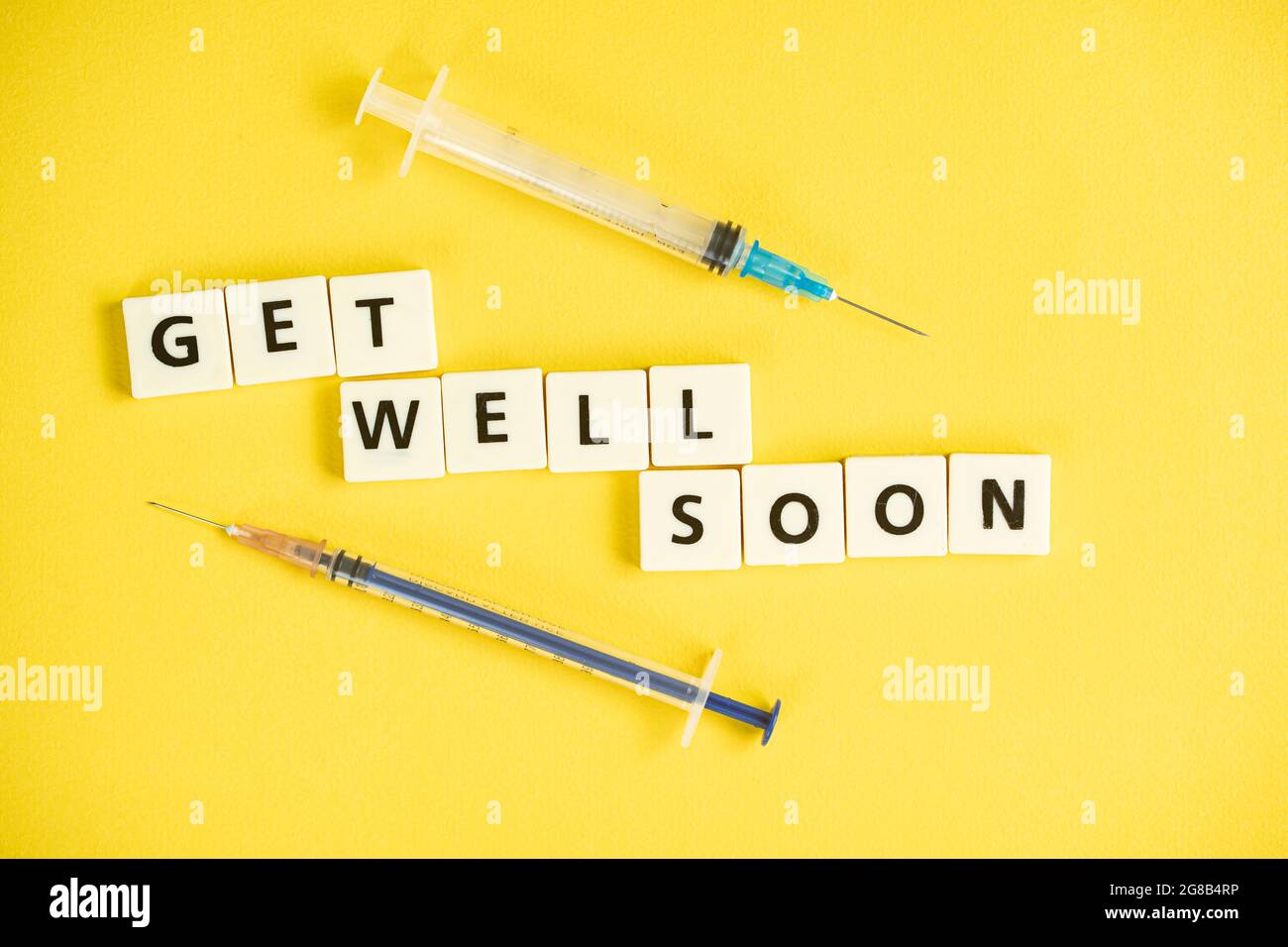 Medical concept. Layout of alphabet blocks and two syringes with text ...