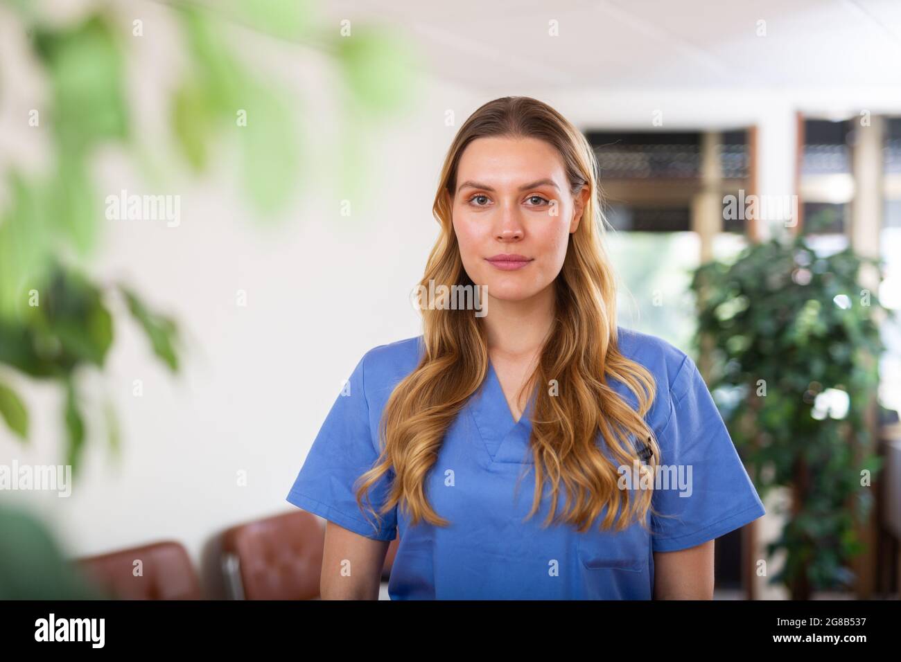 Female doctor assistant standing in medical office Stock Photo - Alamy