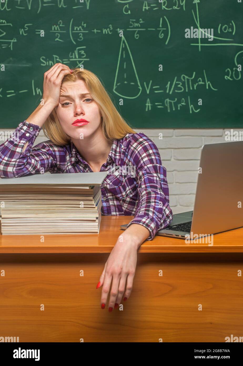 Negative facial expression. Tired student learning at home. Young ...