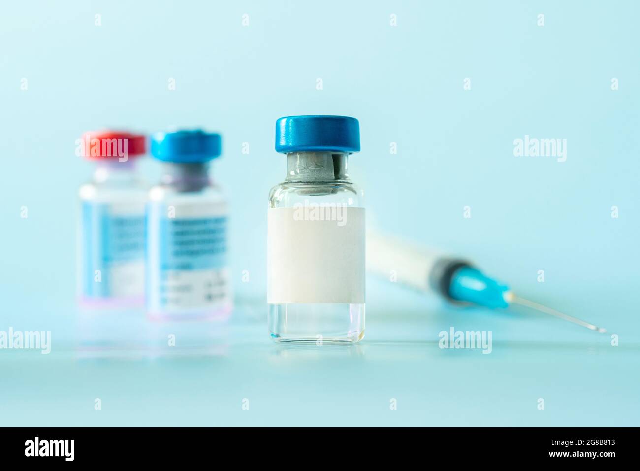 Healthcare and pharmaceutical drugs concept with syringe and vaccine ...