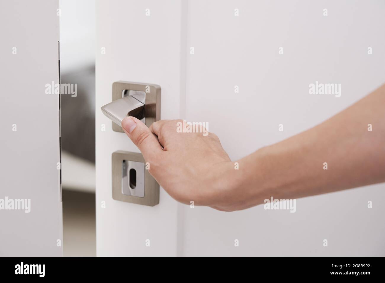 Door handle and hand and woman hi-res stock photography and images - Alamy