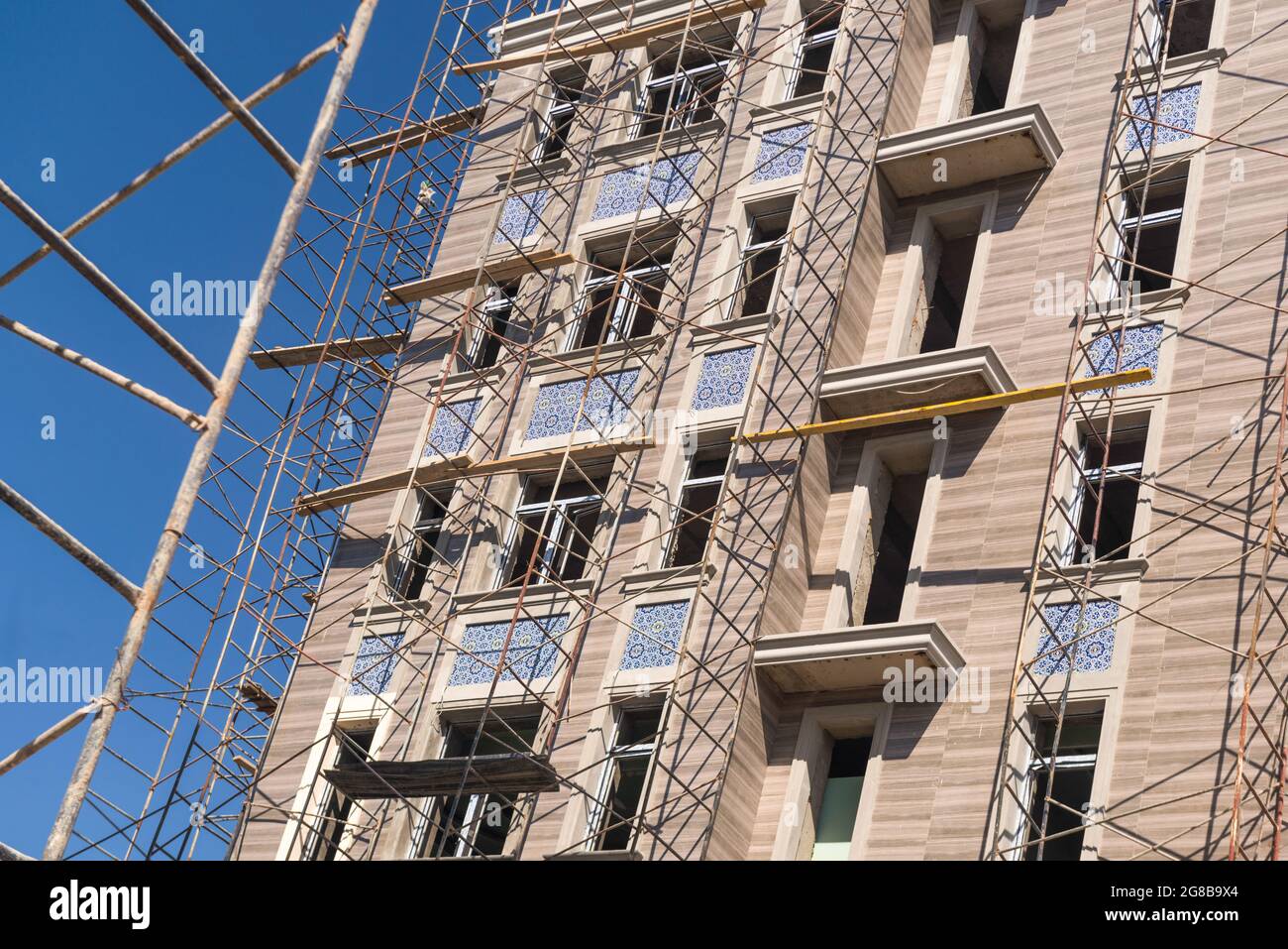 Finishing works on the facade of a new residential buildings Stock ...