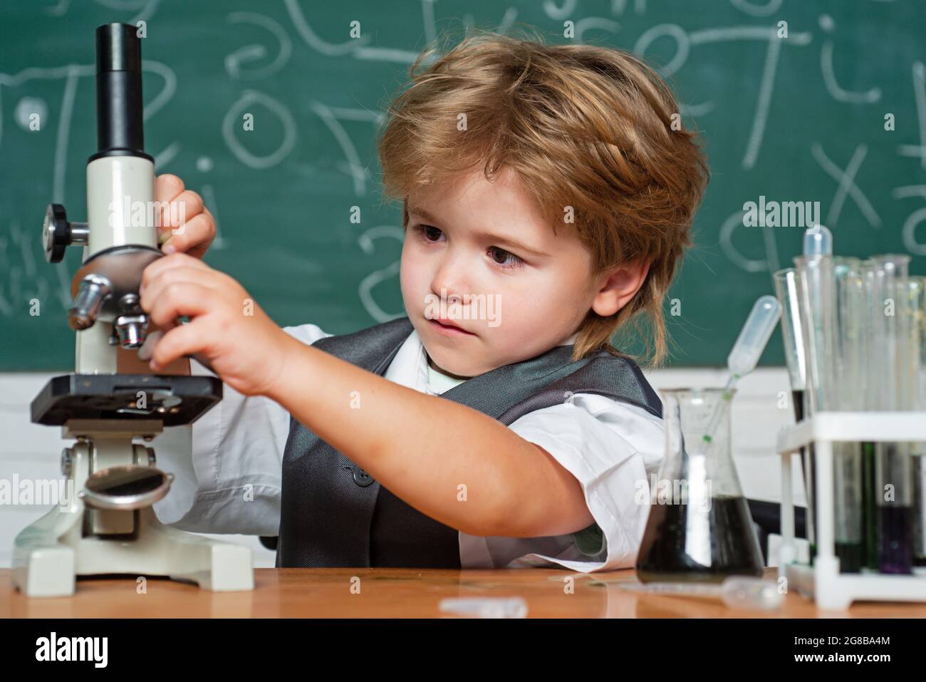 The Science Classroom. Little kid scientist earning chemistry in school ...